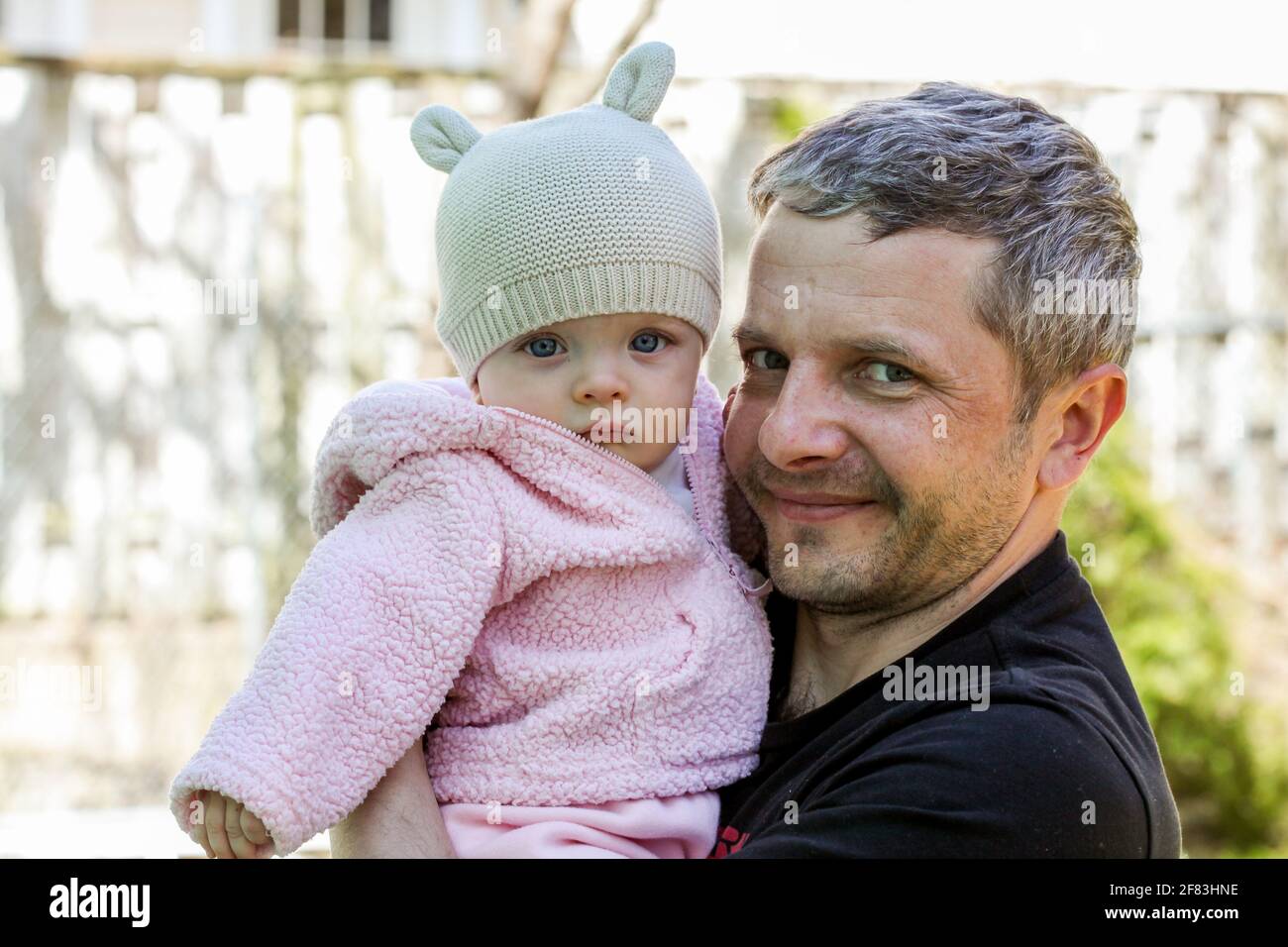 Dad with cute baby girl outside in spring Stock Photo - Alamy