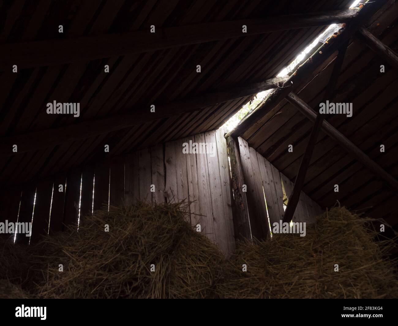 Light passing trough boards of an old barn Stock Photo - Alamy