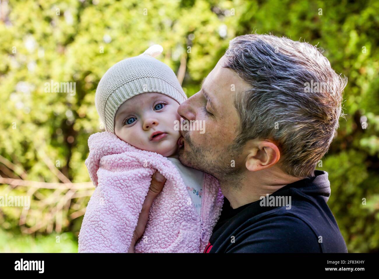 Dad with cute baby girl outside in spring Stock Photo - Alamy