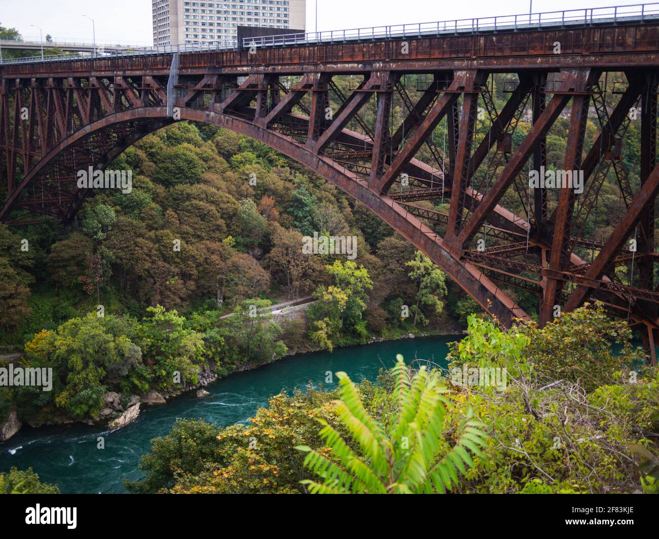 brown bridge made out of steel over the water at a country border Stock ...