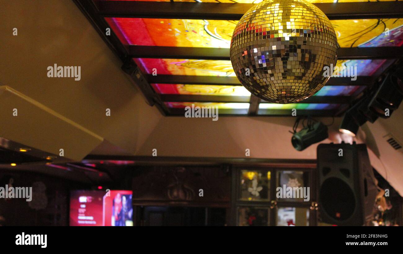 the beautiful interior of a room with a mirror disco ball and colorful ...
