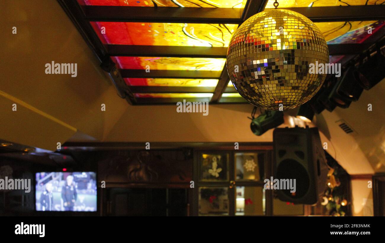 the beautiful interior of a room with a mirror disco ball and colorful ...
