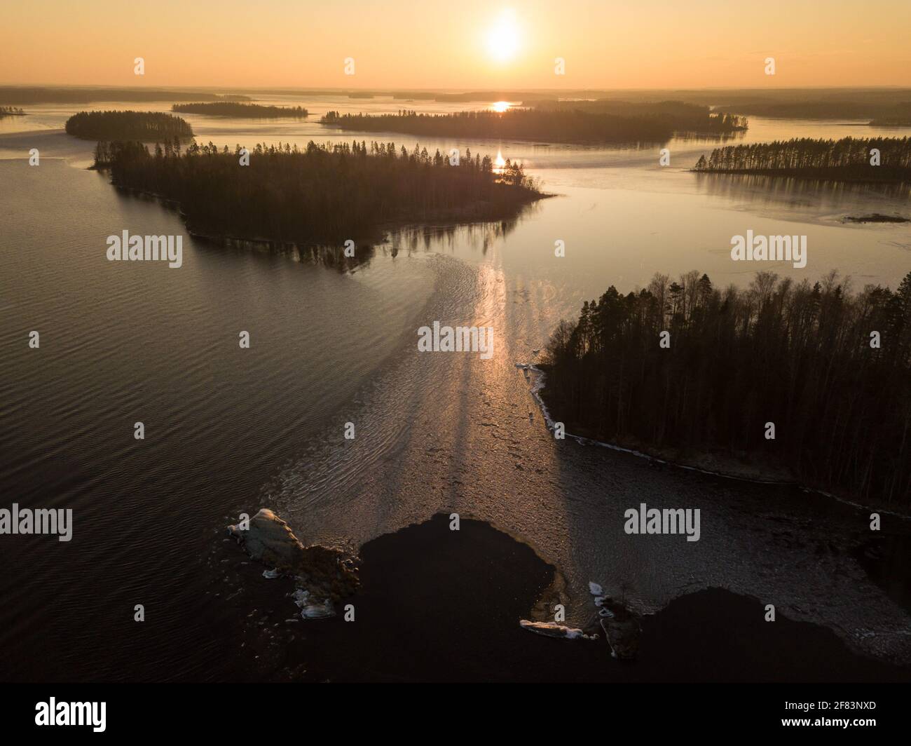 Aerial sunset landscape of freezing lake Stock Photo - Alamy