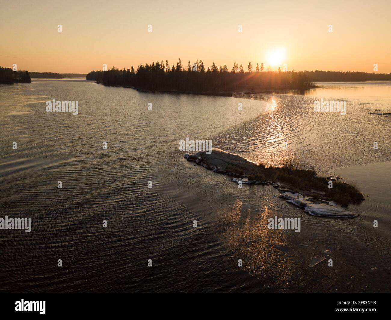 Aerial sunset landscape of freezing lake Stock Photo - Alamy
