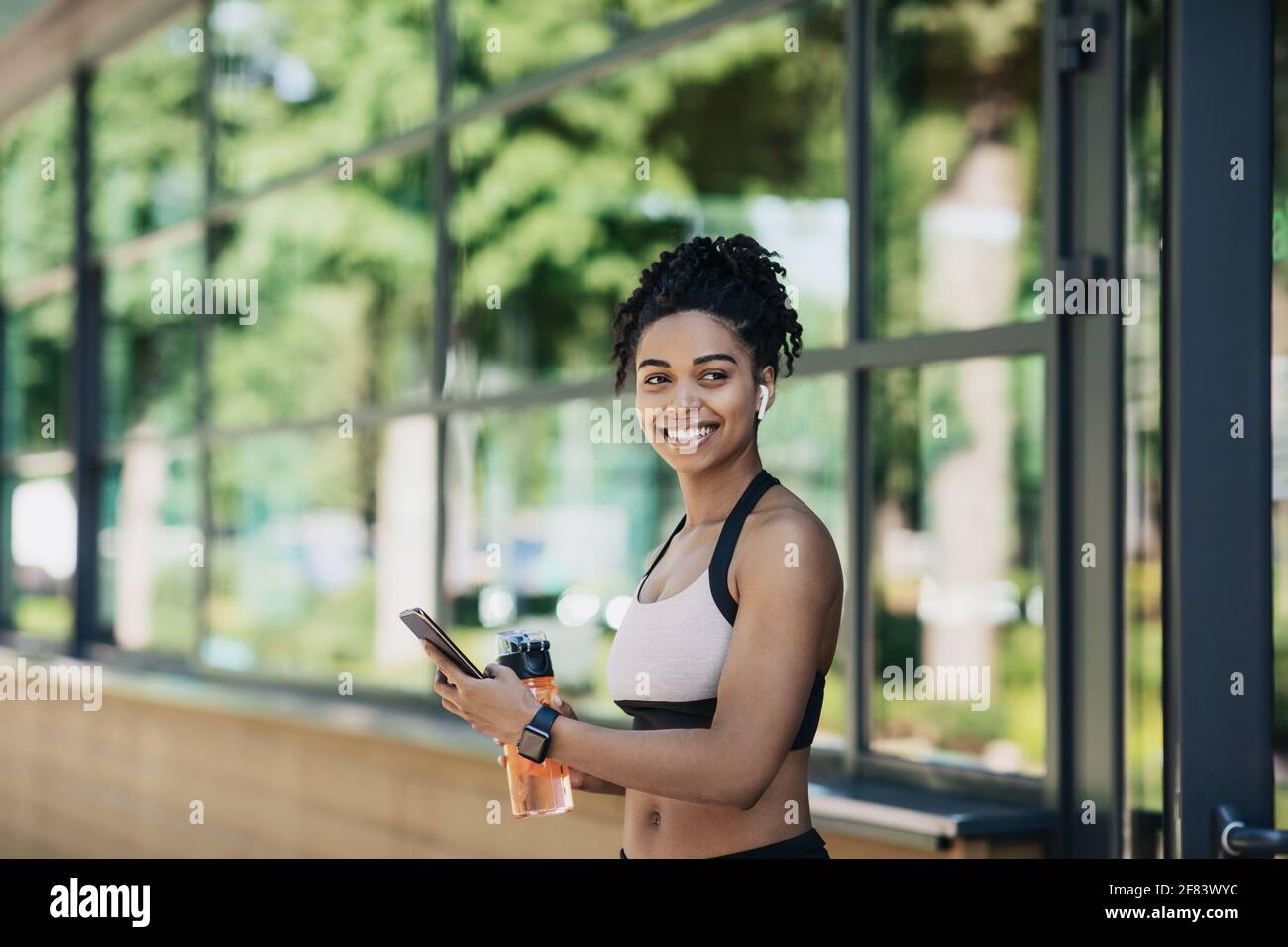 Beautiful muscular trainer, fitness blogger and workout outdoor Stock ...