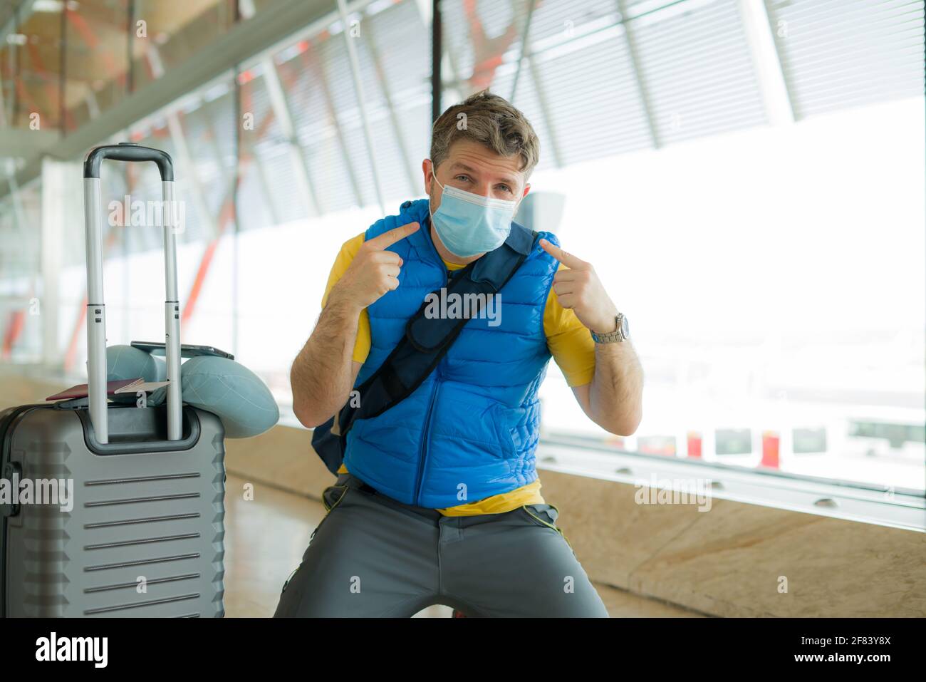 holiday travel and tourism during covid19 - young attractive man ...