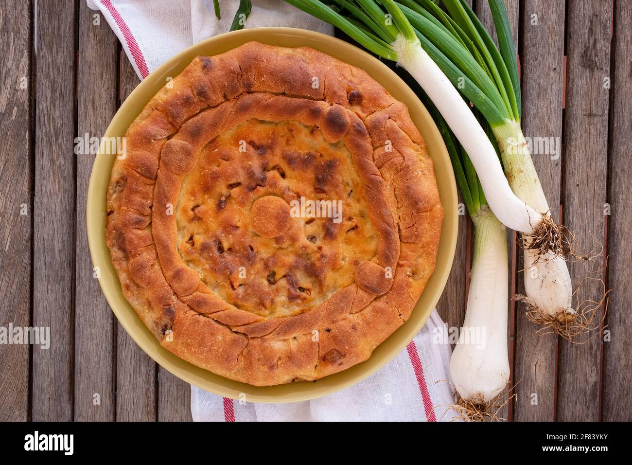 Pizza calzone filled with onion and tuna - Food of Puglia Stock Photo ...