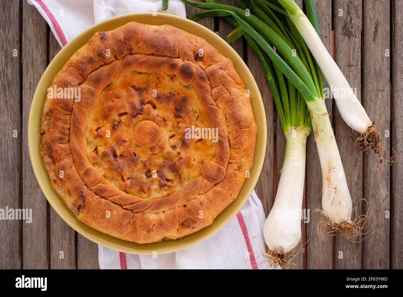Calzone filled with onion and tuna - Traditional stuffed pizza of ...