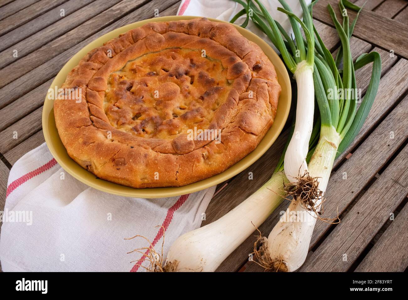 Pizza calzone filled with onion and tuna - Food of Puglia Stock Photo ...