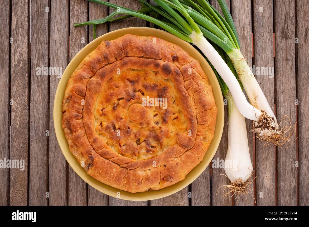 Calzone filled with onion and tuna - Traditional stuffed pizza of ...