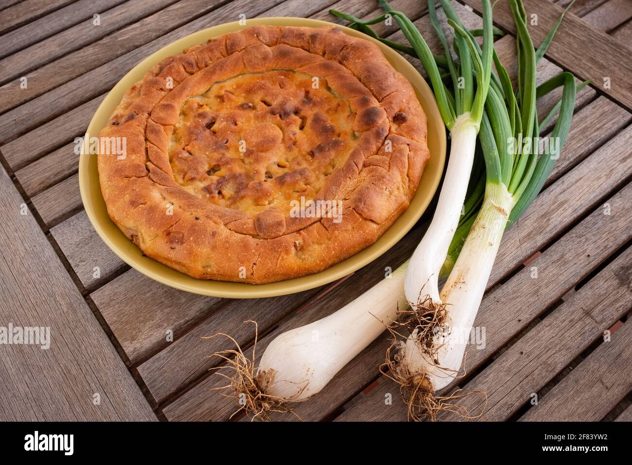 Calzone filled with onion and tuna - Traditional stuffed pizza of ...