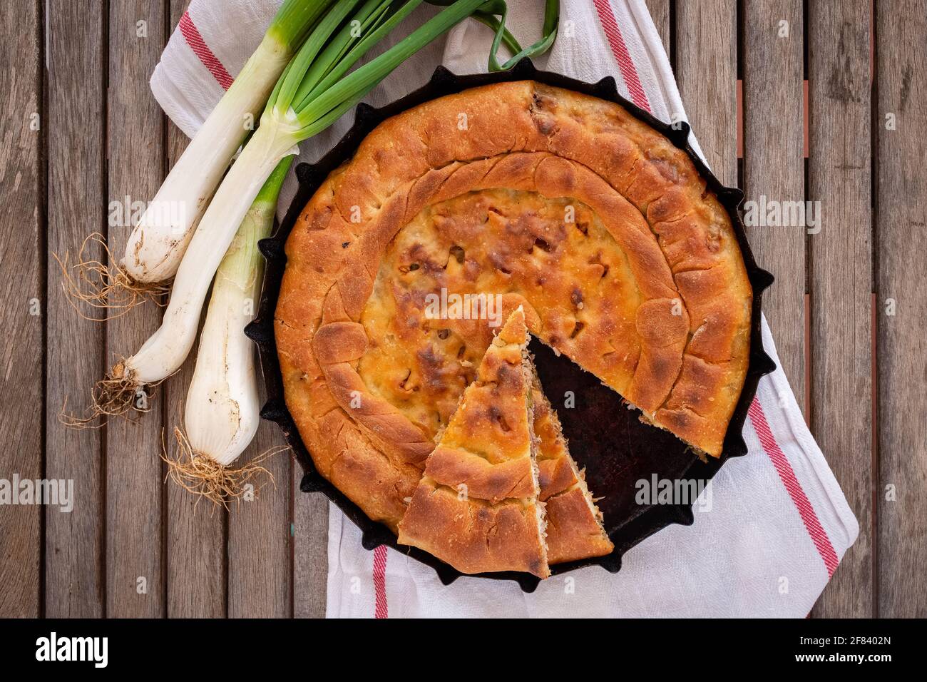 Calzone filled with onion and tuna - Traditional stuffed pizza of ...