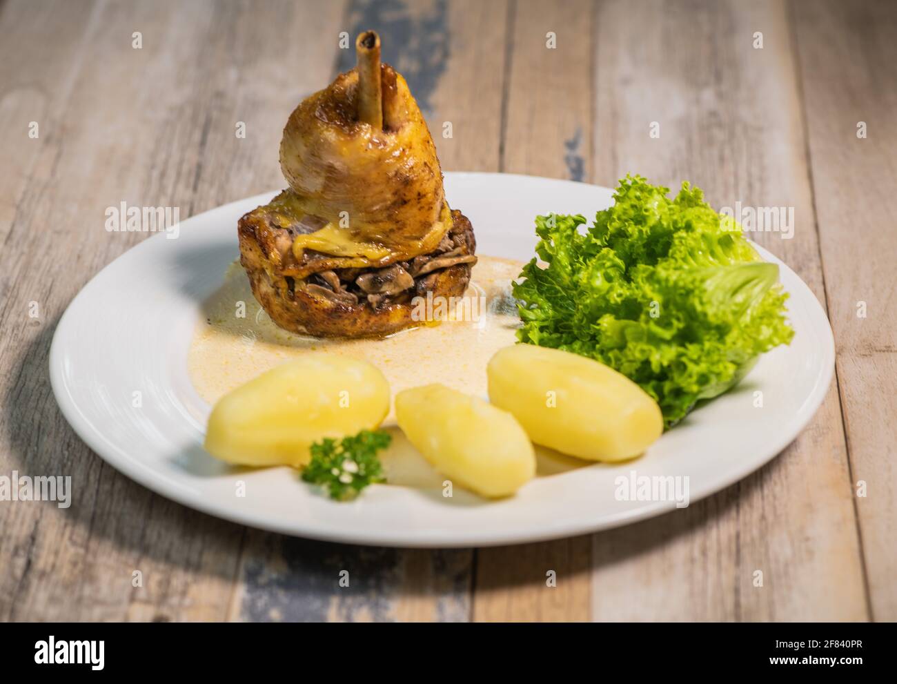 Chicken gigolette recipe with mushrooms accompanied by turned potatoes ...