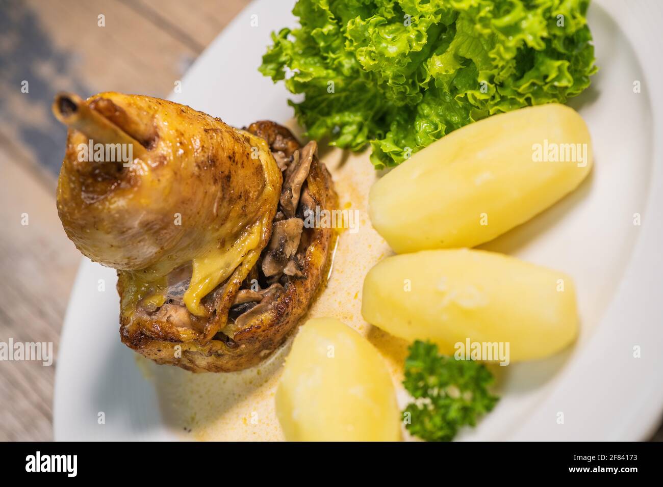 Chicken gigolette recipe with mushrooms accompanied by turned potatoes ...