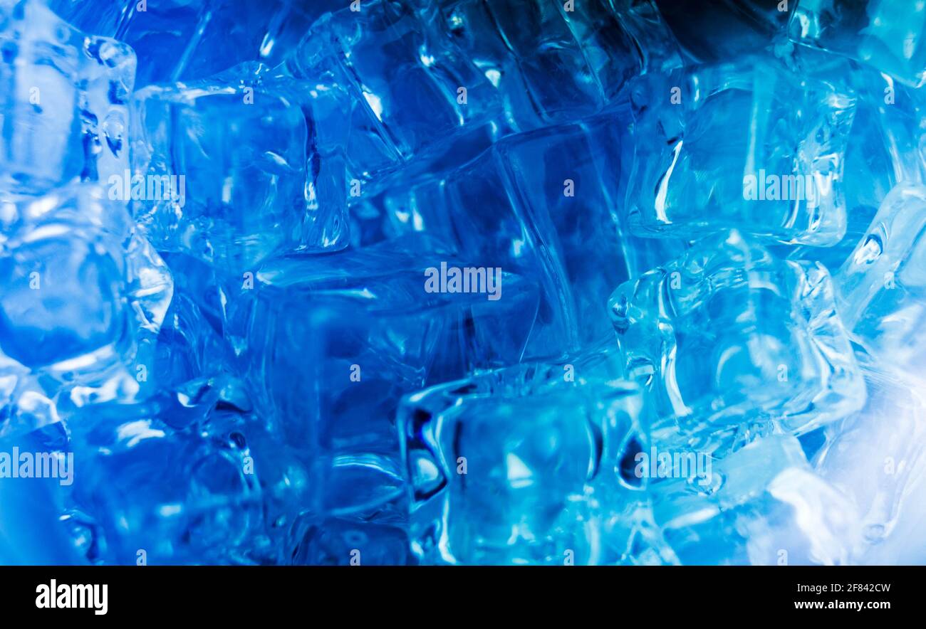 diffuse light shines on a handful of ice cubes Stock Photo - Alamy