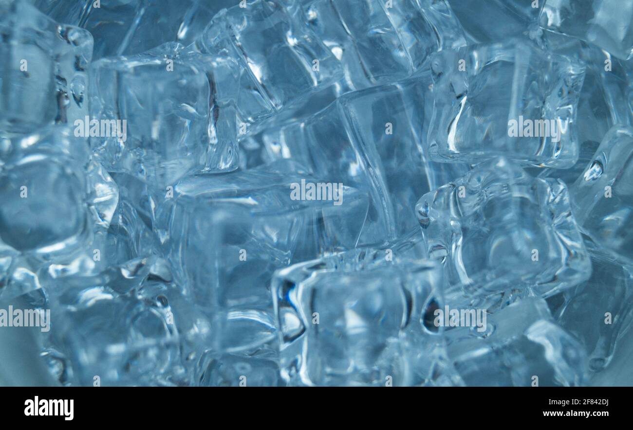 diffuse light shines on a handful of ice cubes Stock Photo - Alamy