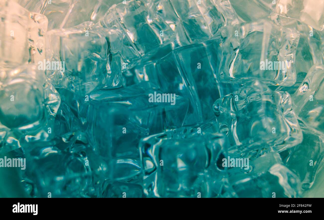 diffuse light shines on a handful of ice cubes Stock Photo - Alamy