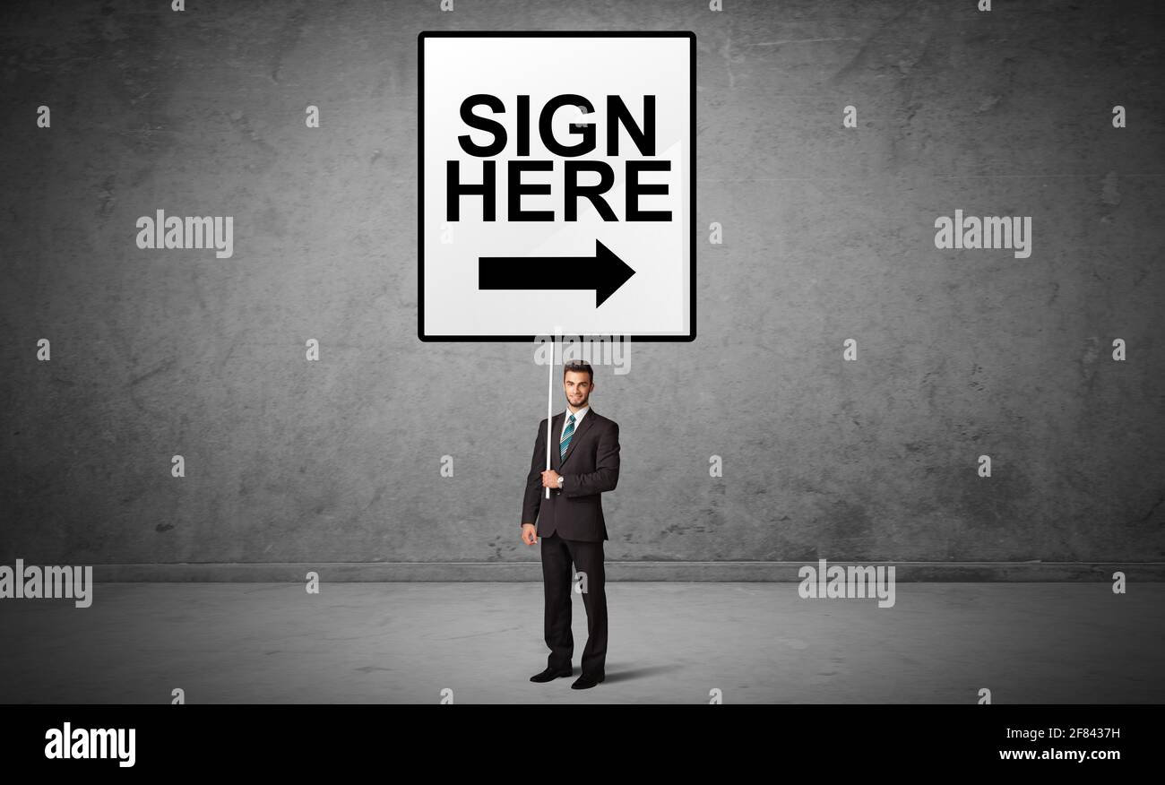business person holding a traffic sign Stock Photo - Alamy