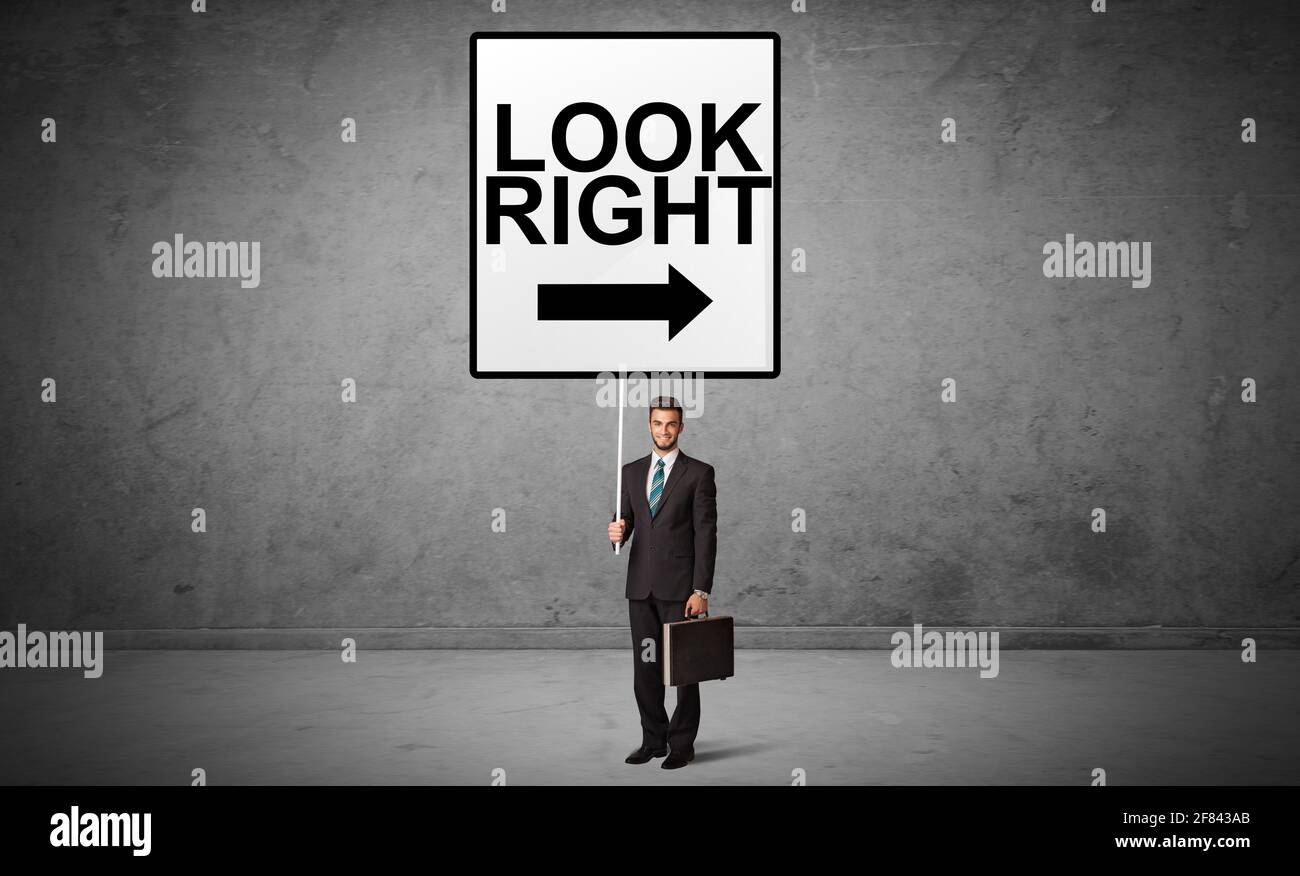 business person holding a traffic sign Stock Photo - Alamy