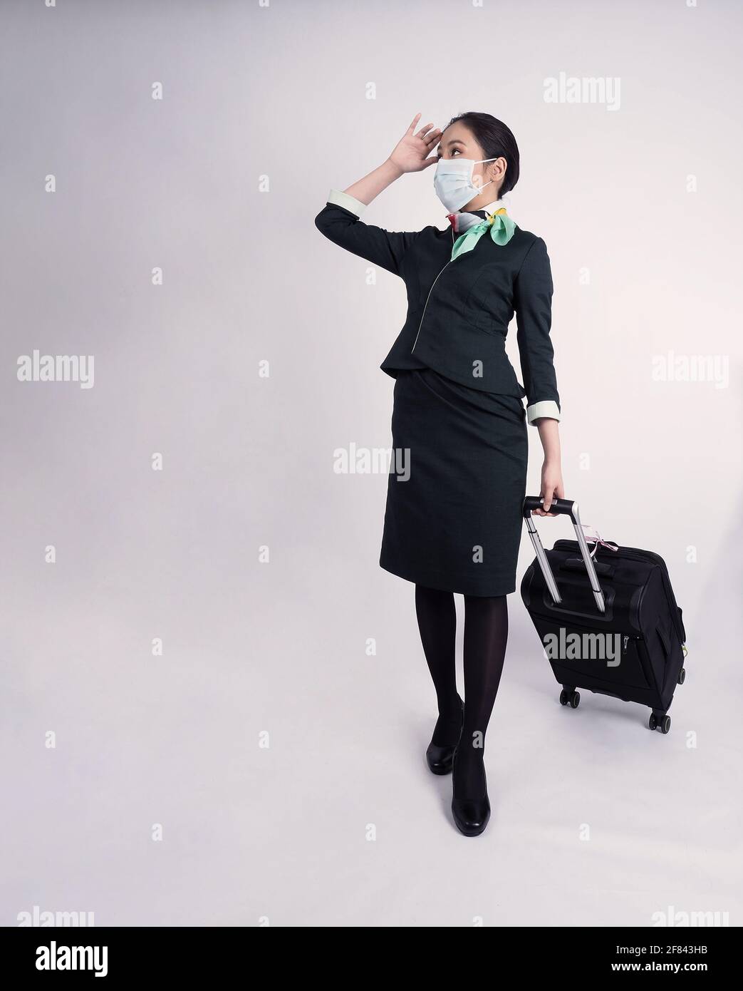 Cabin crew or air hostess with face mask in Covid 19 pandemic. Flight ...