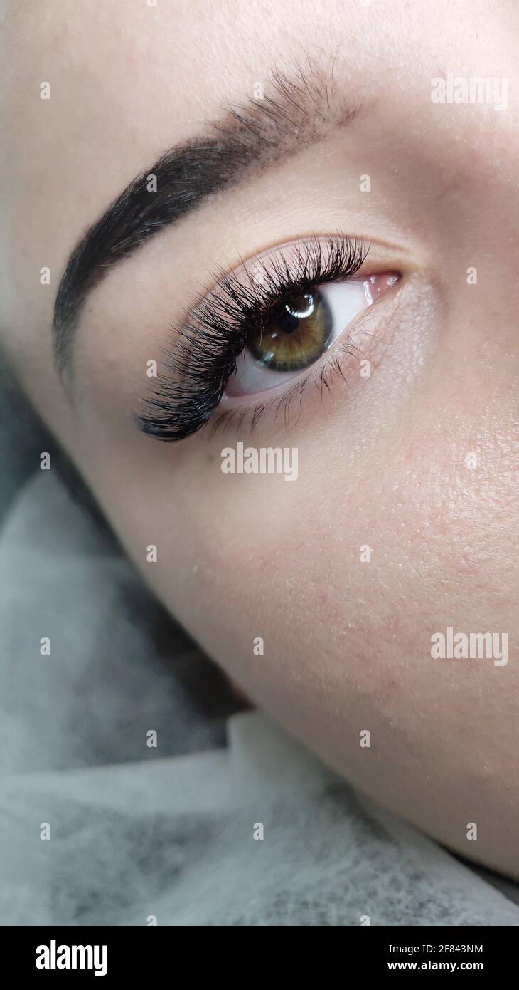 lash extension in beauty salon macro eye Stock Photo - Alamy