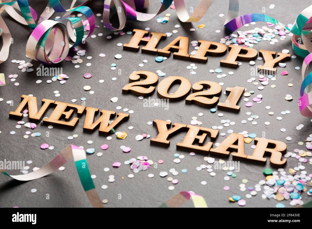 Happy year 2021 - Letters in wood. Black background Stock Photo - Alamy