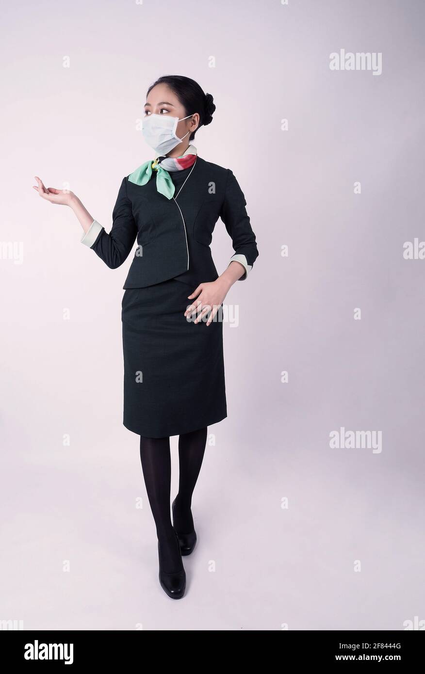Cabin crew or air hostess with face mask in Covid 19 pandemic. Flight ...