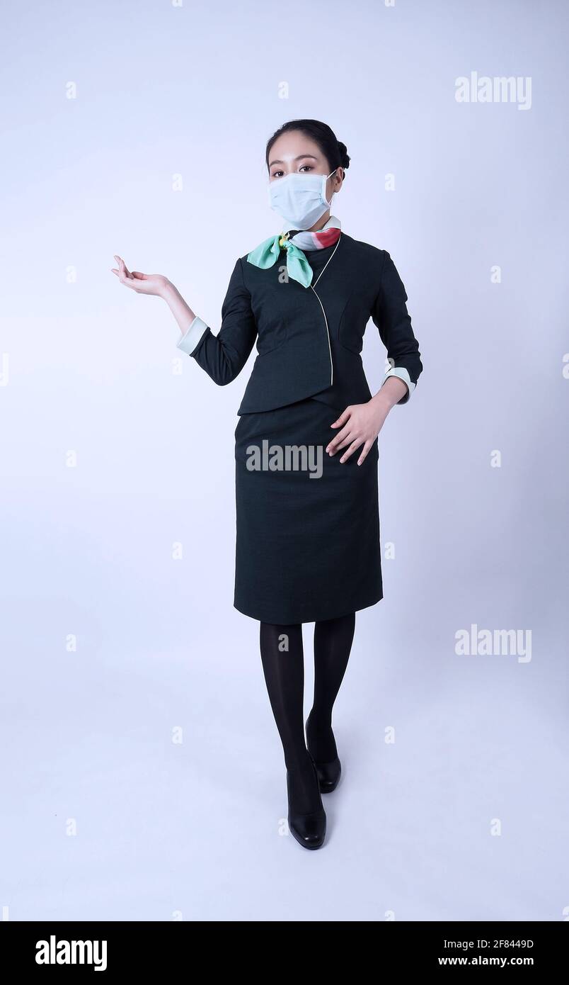 Cabin crew or air hostess with face mask in Covid 19 pandemic. Flight ...