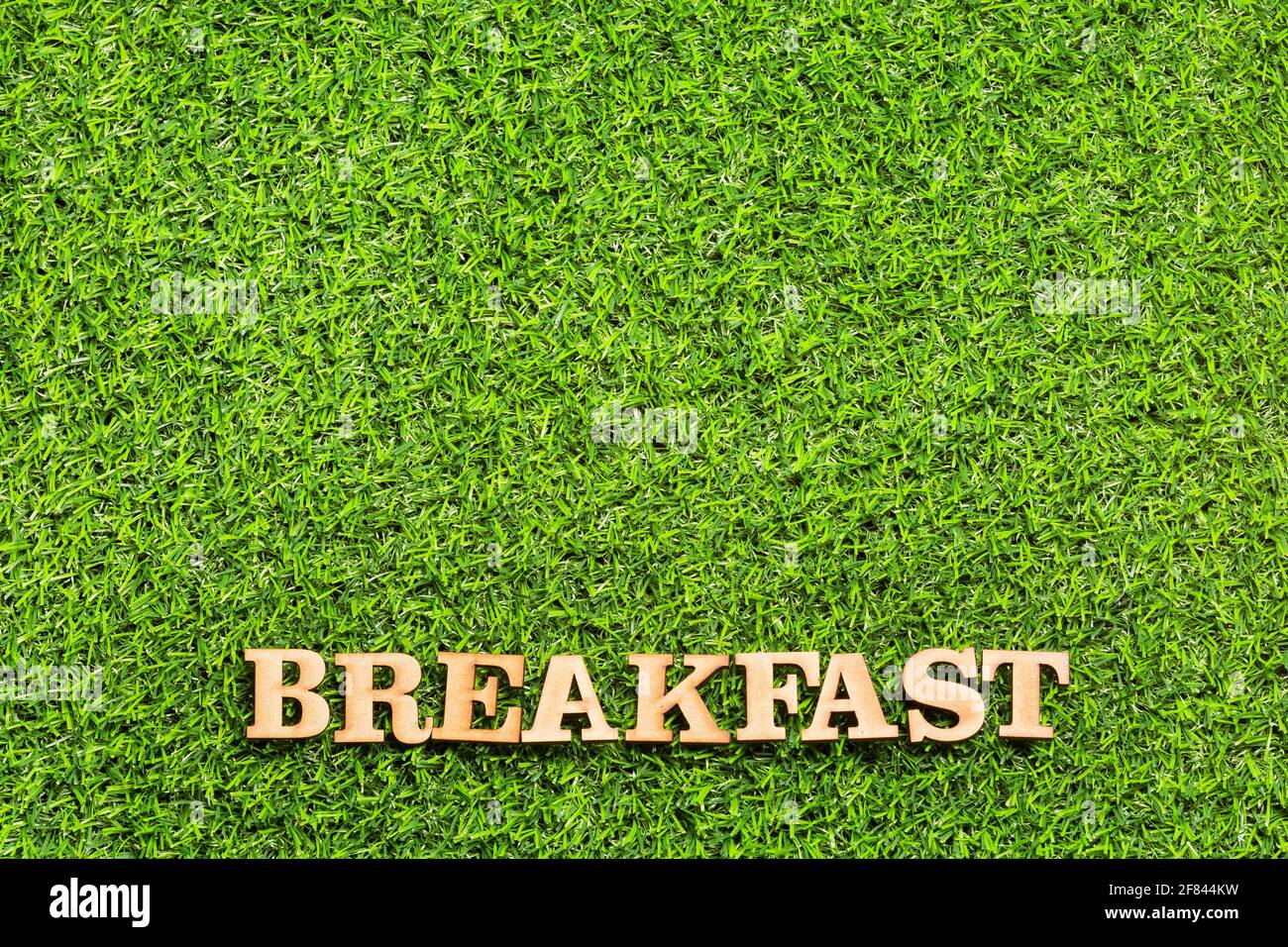 Word breakfast in wooden letters - Green grass. Background for design ...