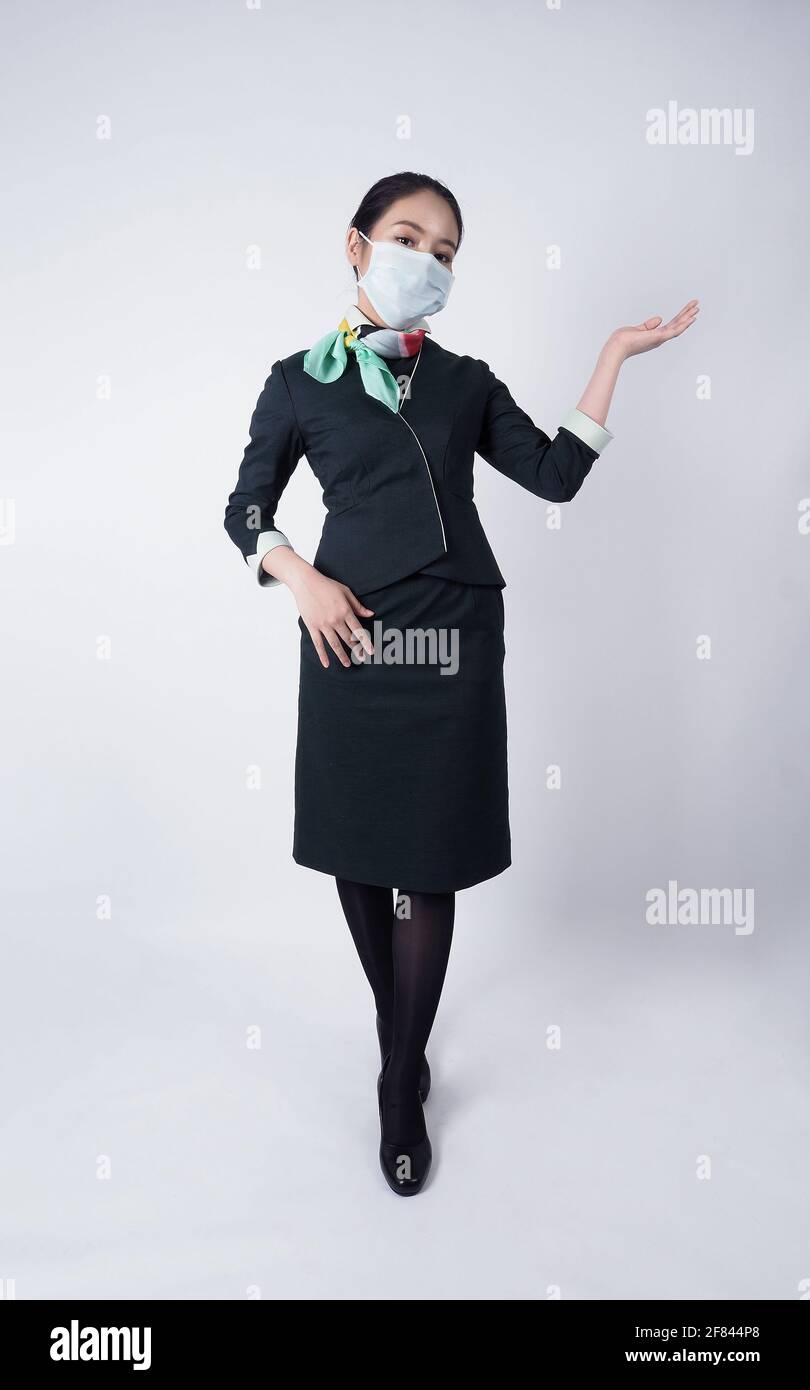 Cabin crew or air hostess with face mask in Covid 19 pandemic. Flight ...