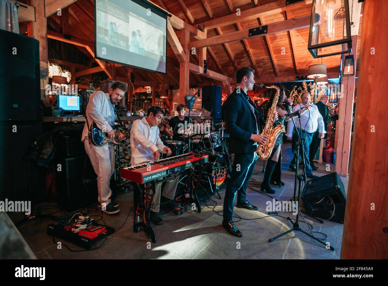group of musicians performing at a party live music Stock Photo - Alamy