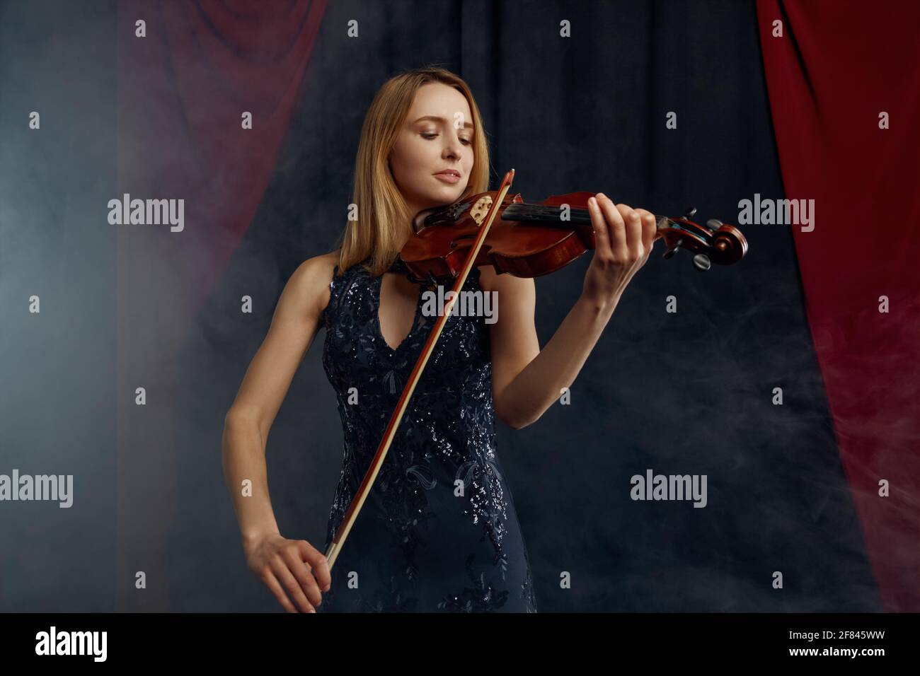 Female violonist with bow and violin, solo concert Stock Photo - Alamy