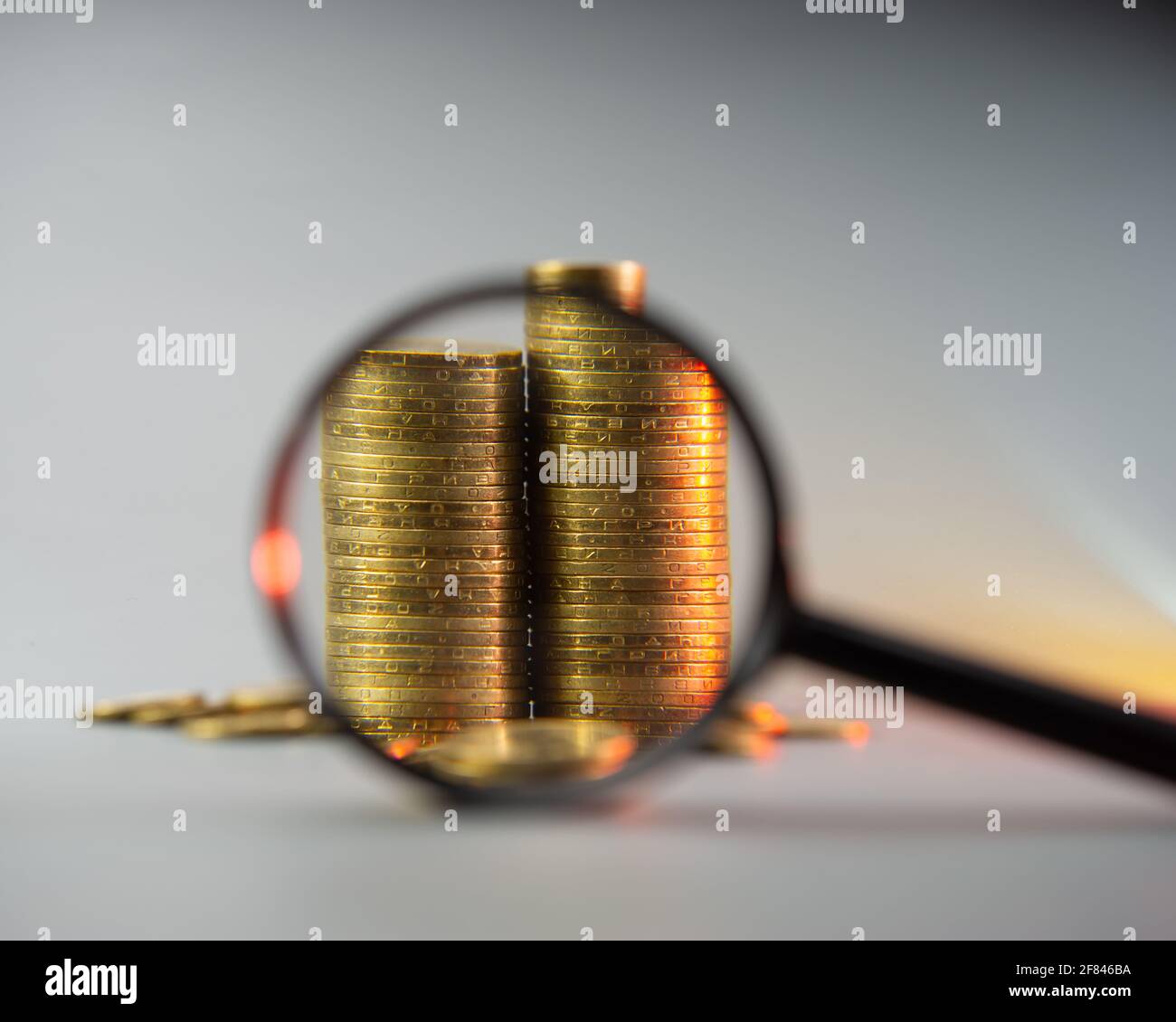 Coin collection with a magnifying glass hi-res stock photography and ...