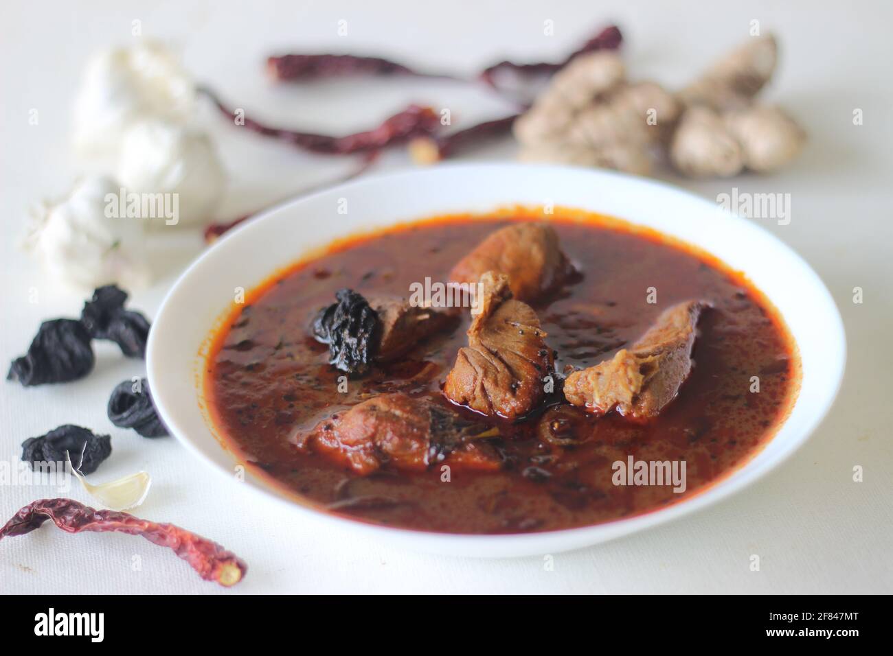fish curry with red gravy prepared in traditional kerala style. Fish ...