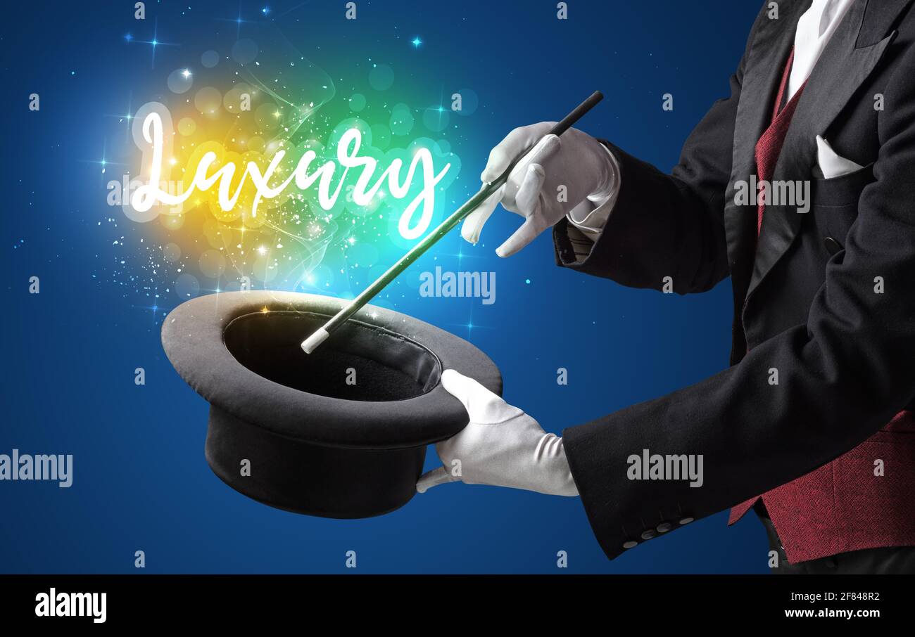 Young magician is showing magic trick Stock Photo - Alamy