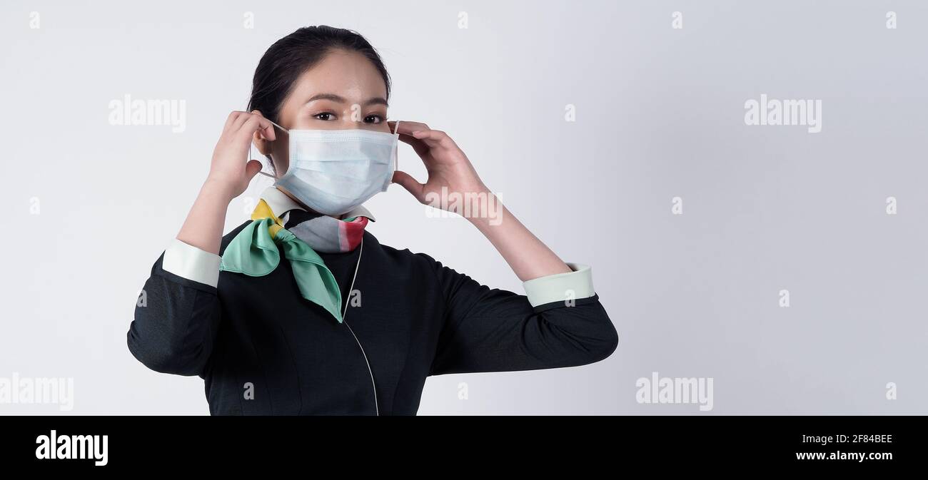 Cabin crew or air hostess with face mask in Covid 19 pandemic. Flight ...