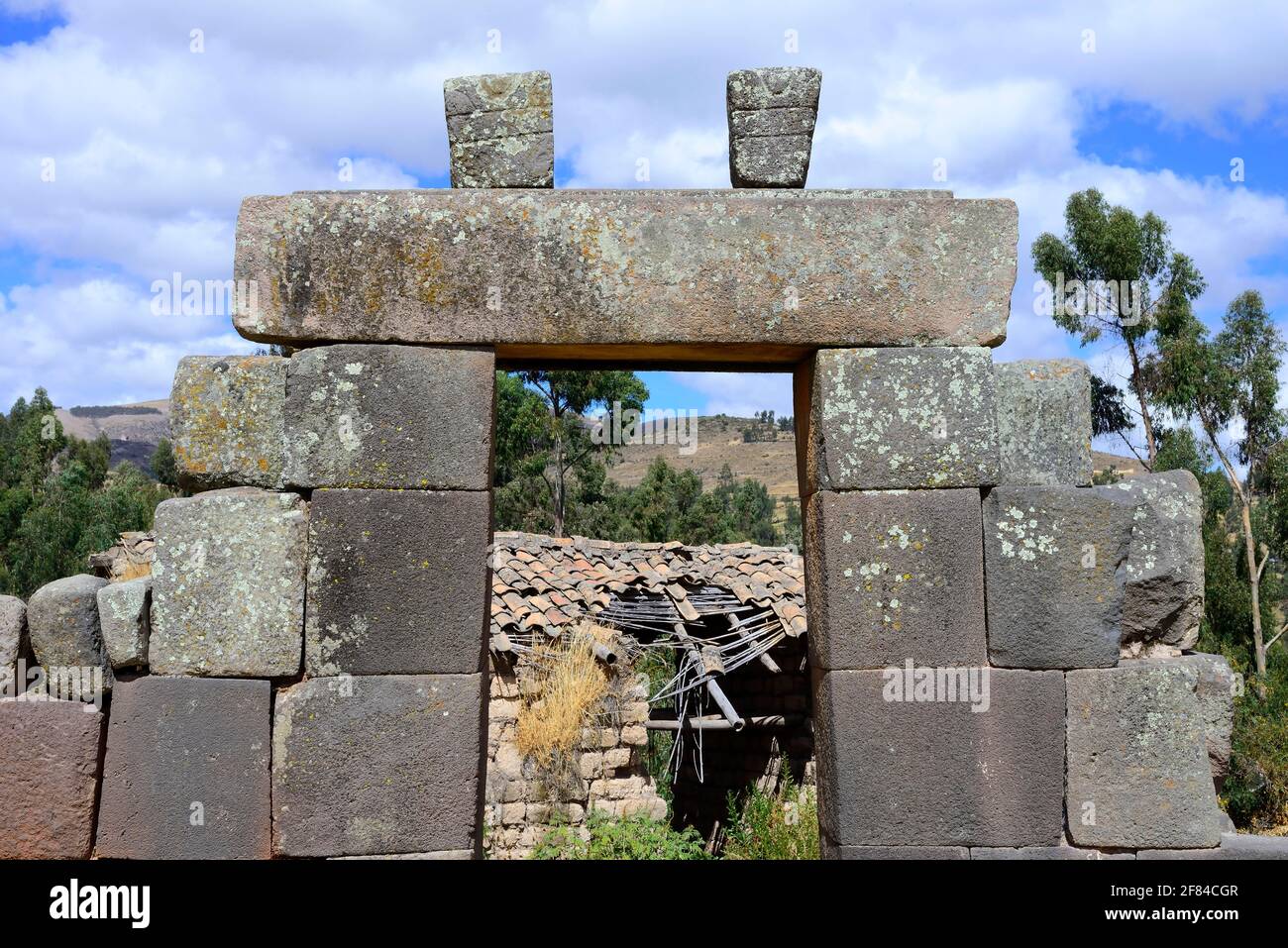 Dilapidated house behind a gate to the pyramid of the Incas, Ushnu ...