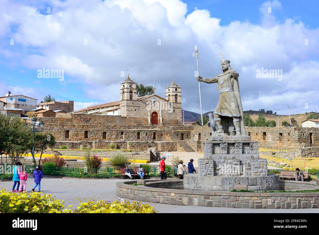 Statue of the Inca Pachacutec in front of sun temple with attached ...
