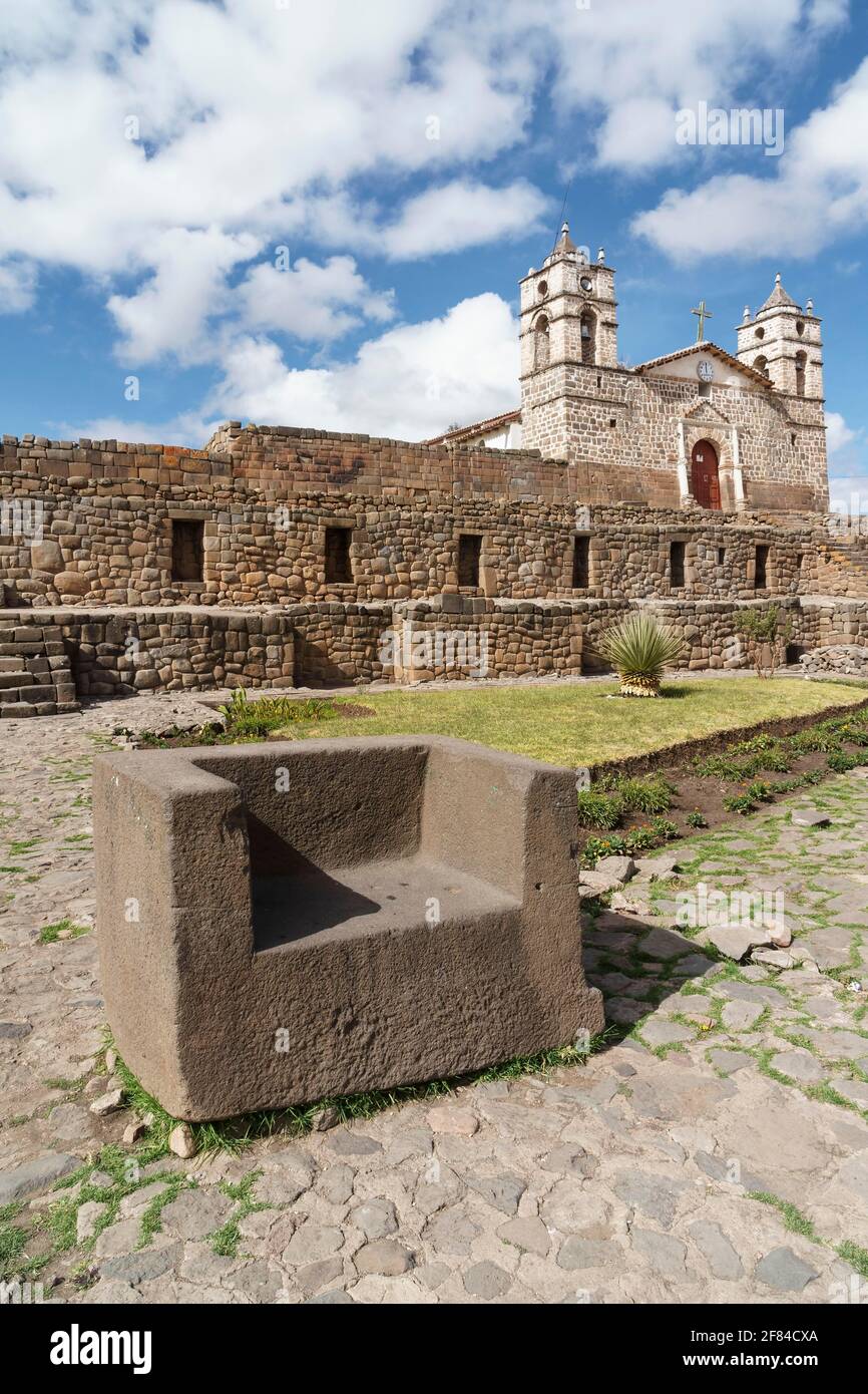 Stone throne in front of the Inca Sun Temple with attached cathedral ...