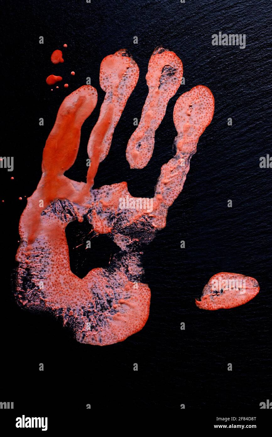 Red handprint on a slate, Germany Stock Photo - Alamy