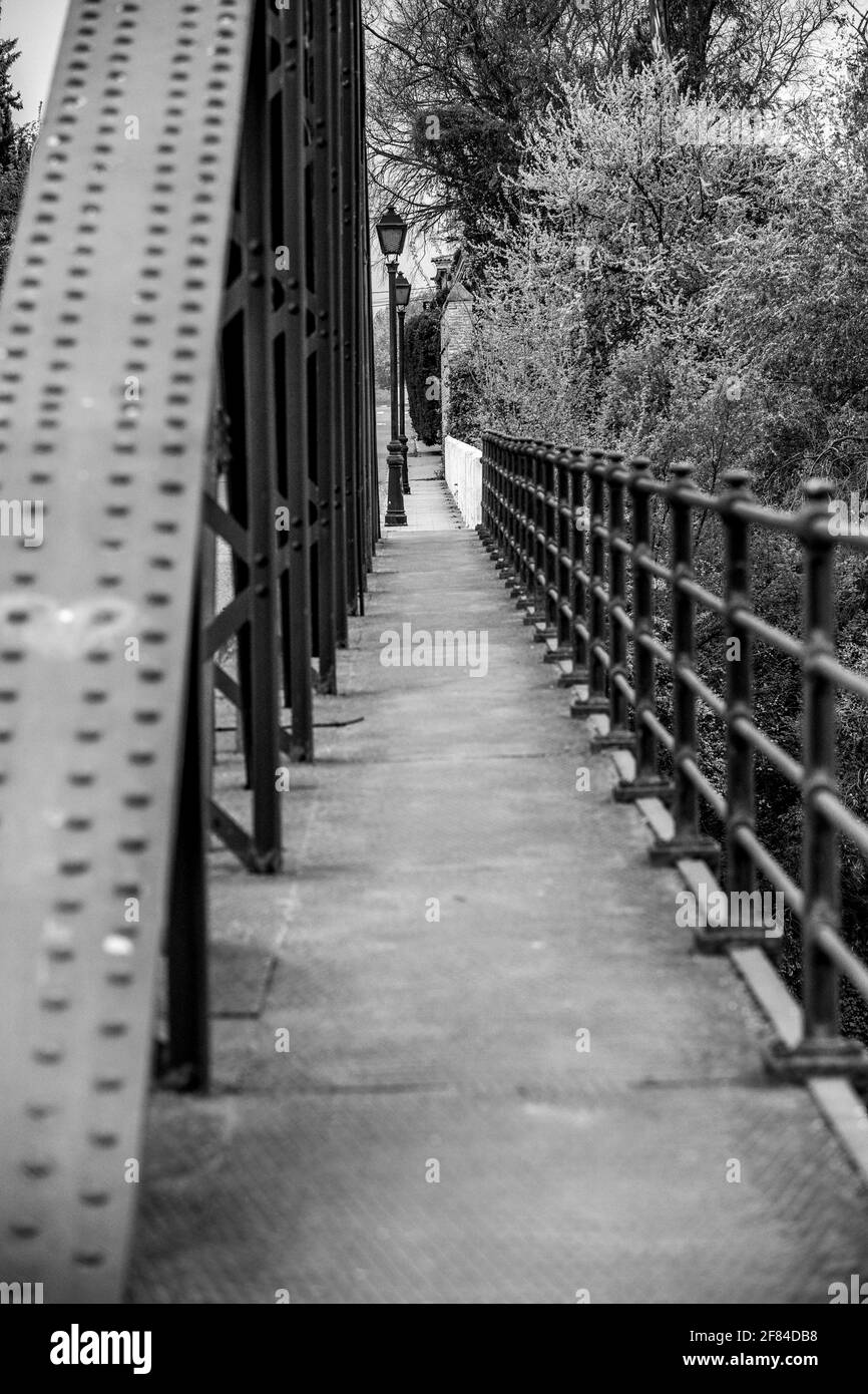 A pedestrian pathway on a metallic bridge Stock Photo - Alamy