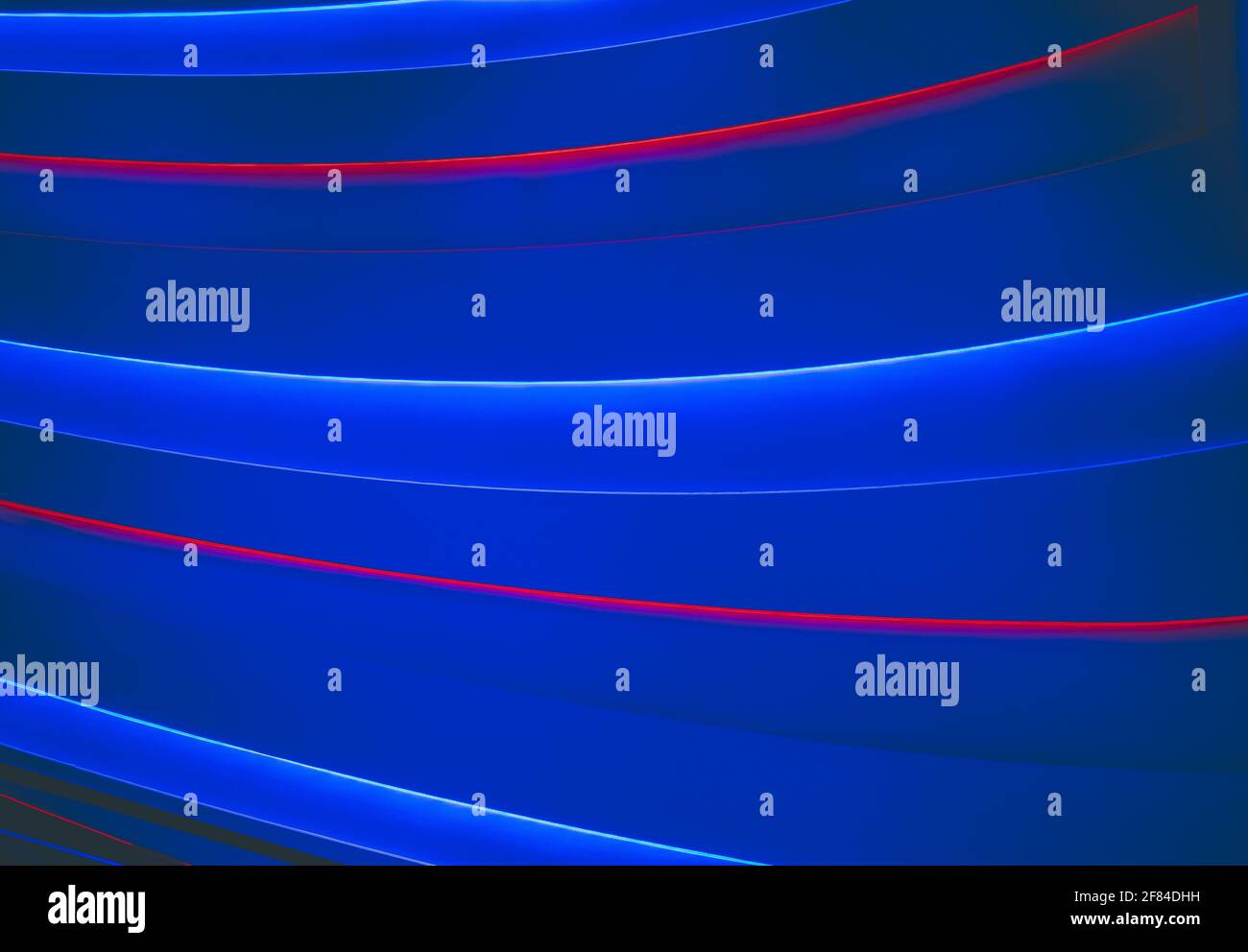 A bright blue and red led wavy lights background Stock Photo - Alamy