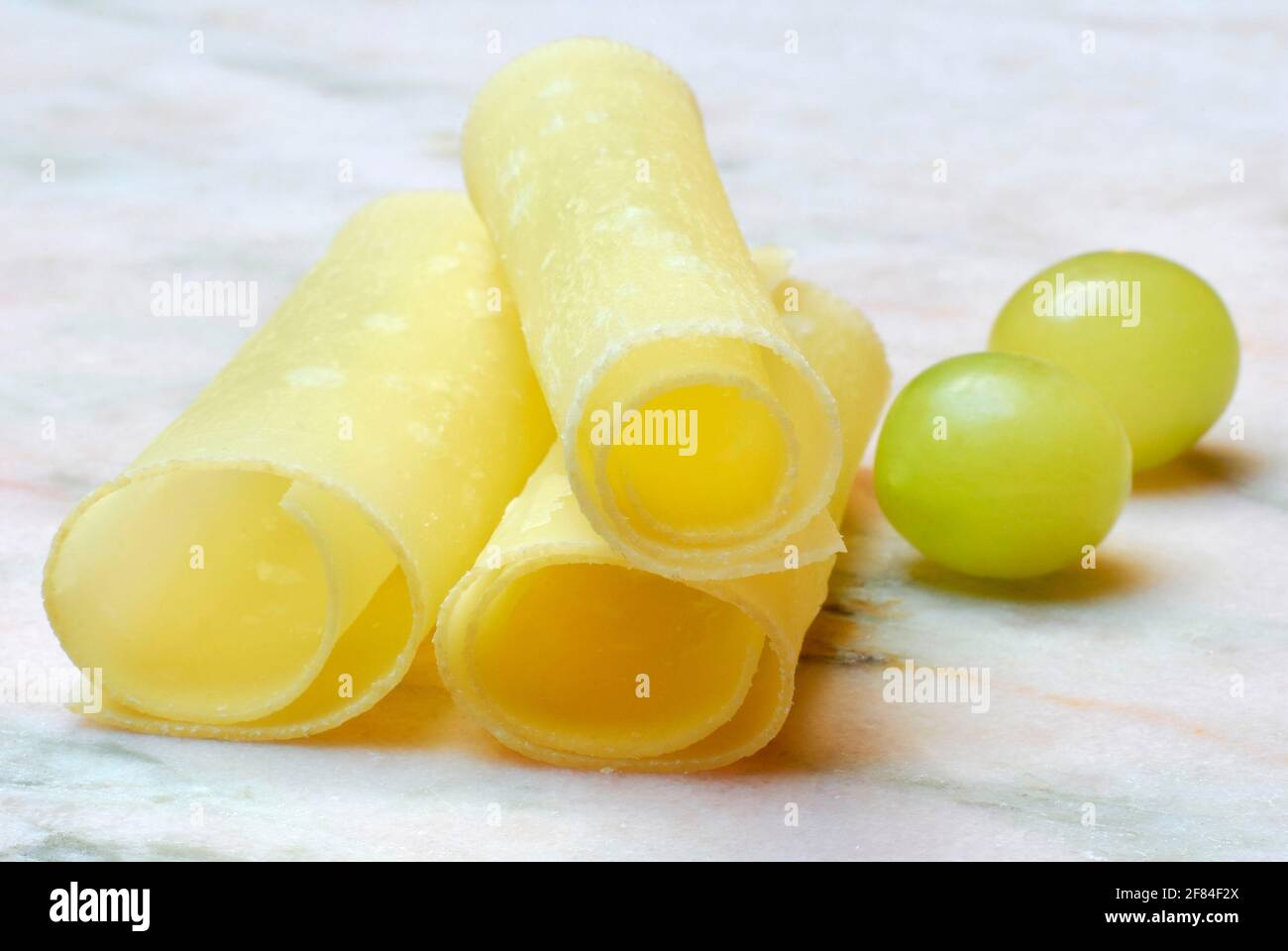 Planed and rolled, sliced, alpine cheese, hard cheese, raw milk cheese ...