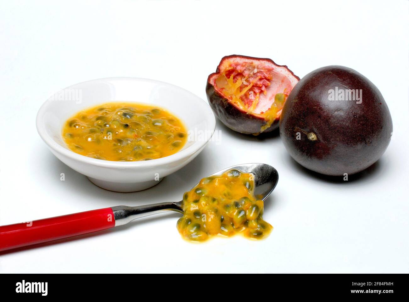 Passion fruit, pulp in shell, spoon (Passiflora) , passion fruit, spoon ...