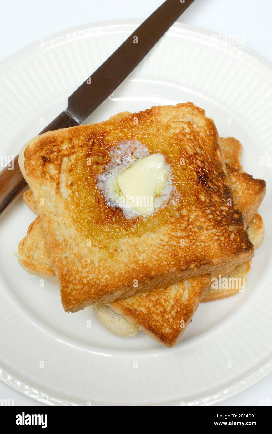 Toast, melting butter, toast, plate, knife Stock Photo - Alamy