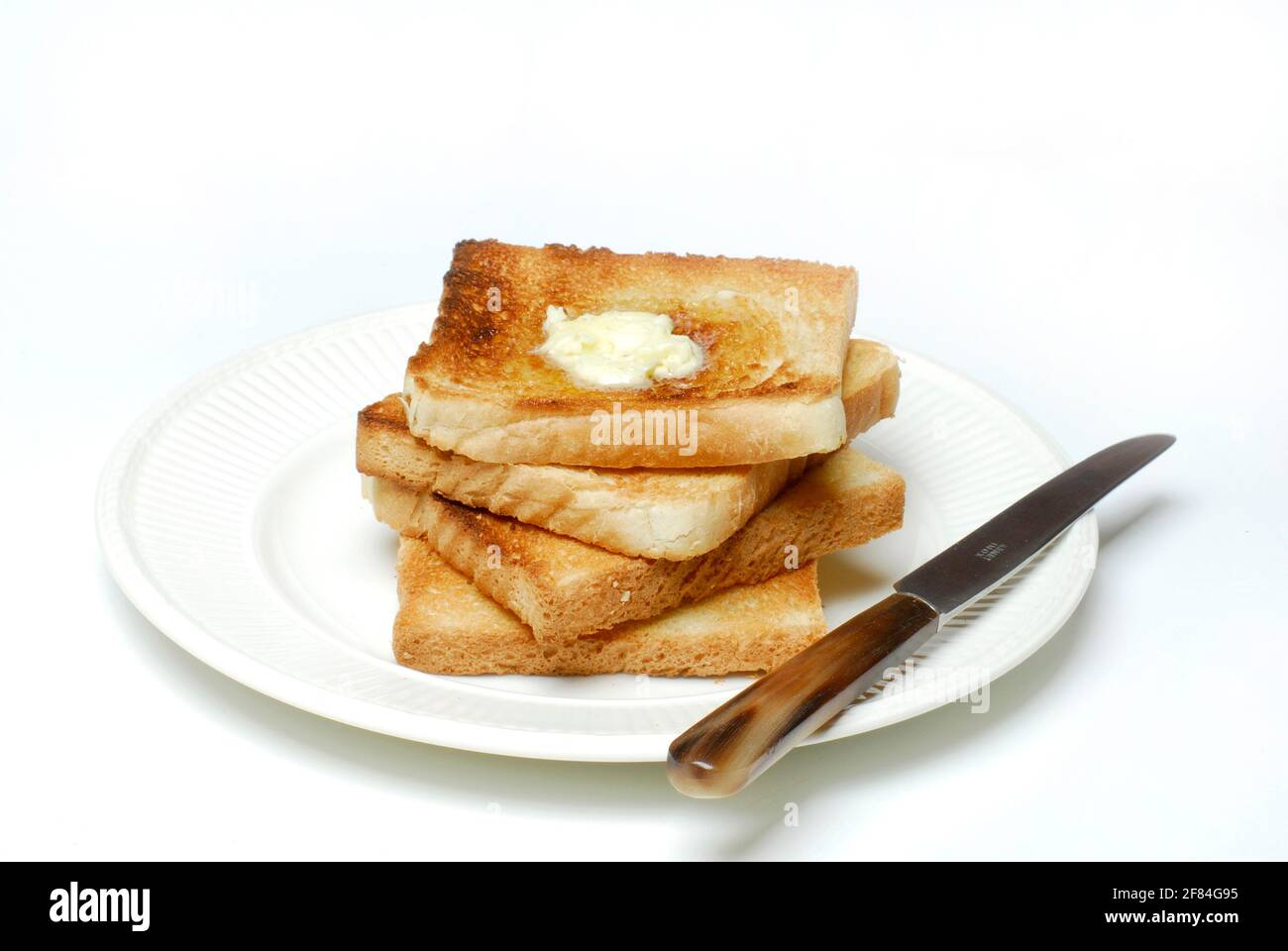 Toast, melting butter, toast, plate, knife Stock Photo - Alamy