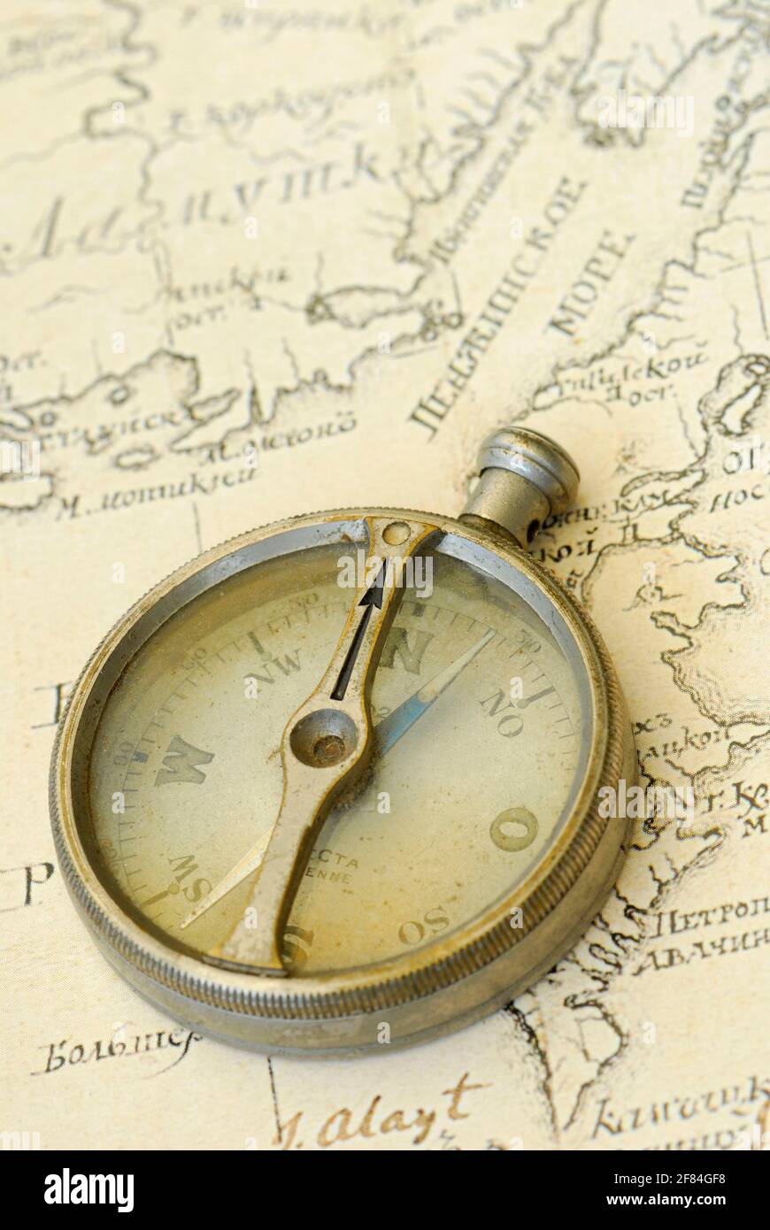 Old compass on map, orientation, discovery, explorer Stock Photo - Alamy