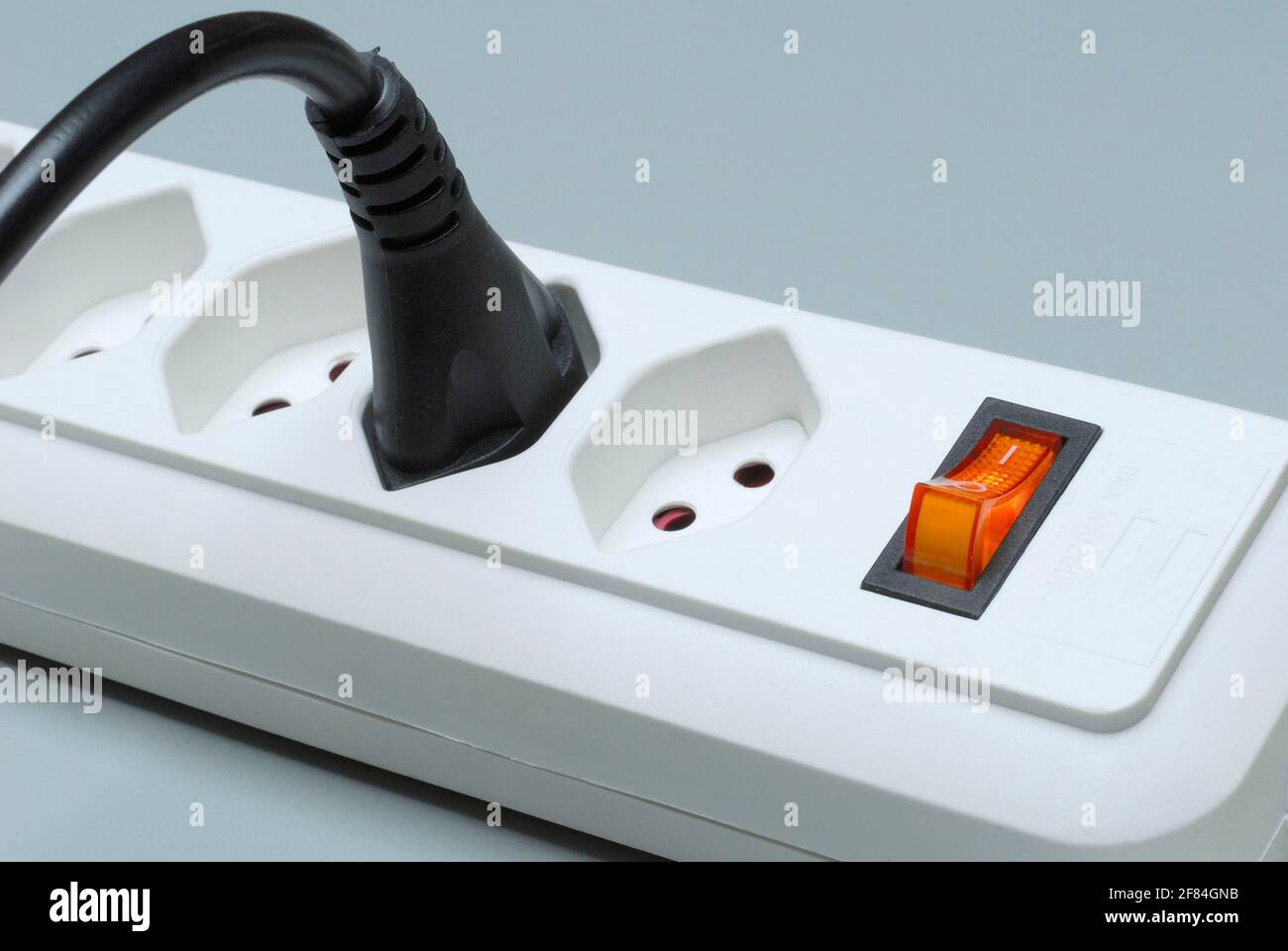 Socket strip with swiss plug, switch Stock Photo - Alamy