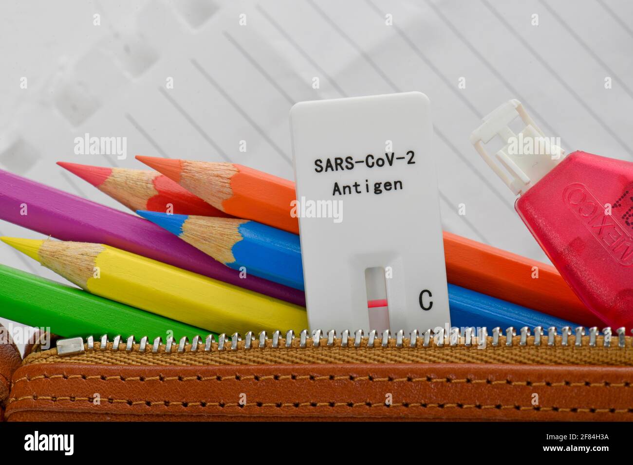 Symbolic image compulsory testing at schools, quick test cassette lies ...