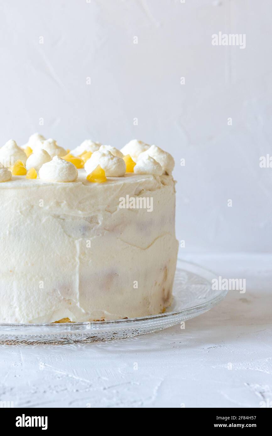Lemon Victoria Sponge Cake decorated with dots of mascarpone cream and ...